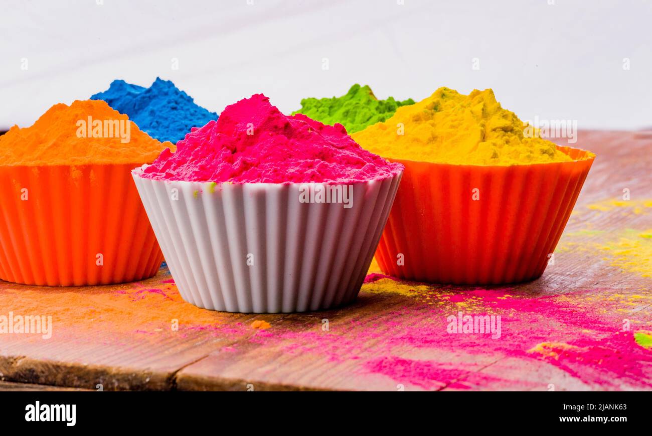 Bows of colorful Holi power arranged on floor. Indian Holi festival ...