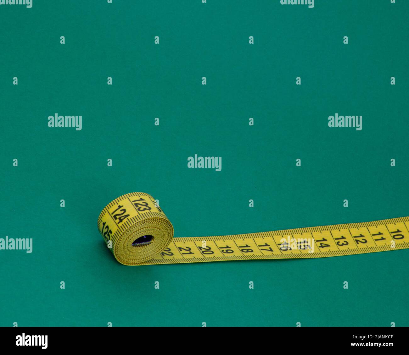 Colorful tape measure spiral with copyspace background Stock Photo - Alamy