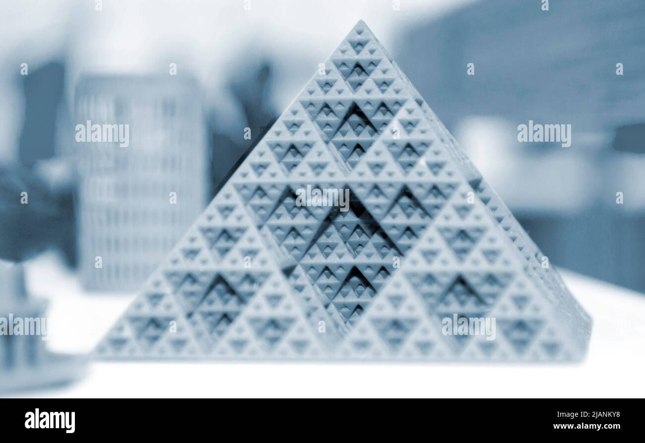 Abstract model pyramid printed on 3d printer. Object photopolymer ...