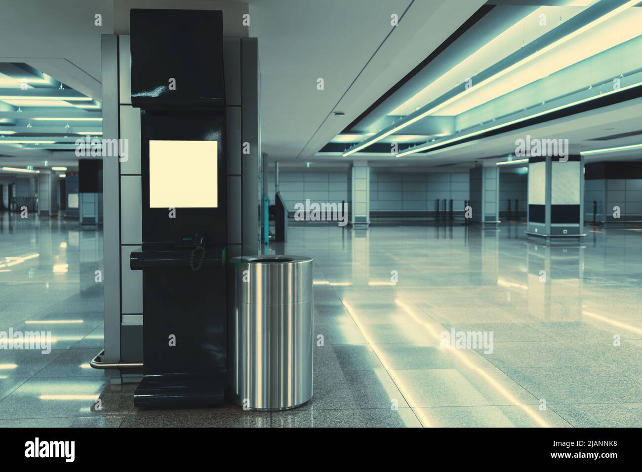 A wide-angle view of a modern opened phone booth with a payphone ...