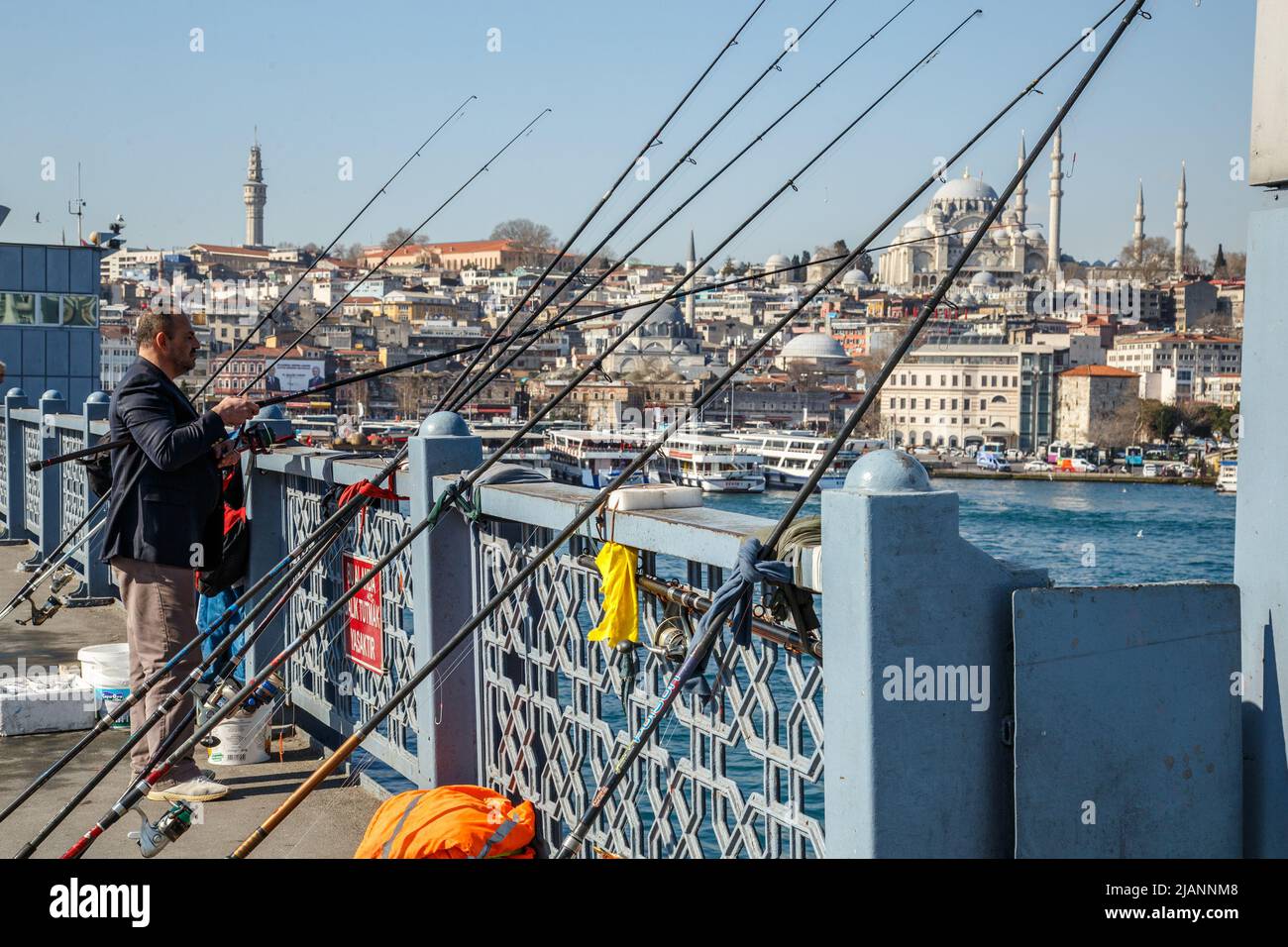Istanbul, Turkey - March 22, 2019: A local fisherman fishing on the ...