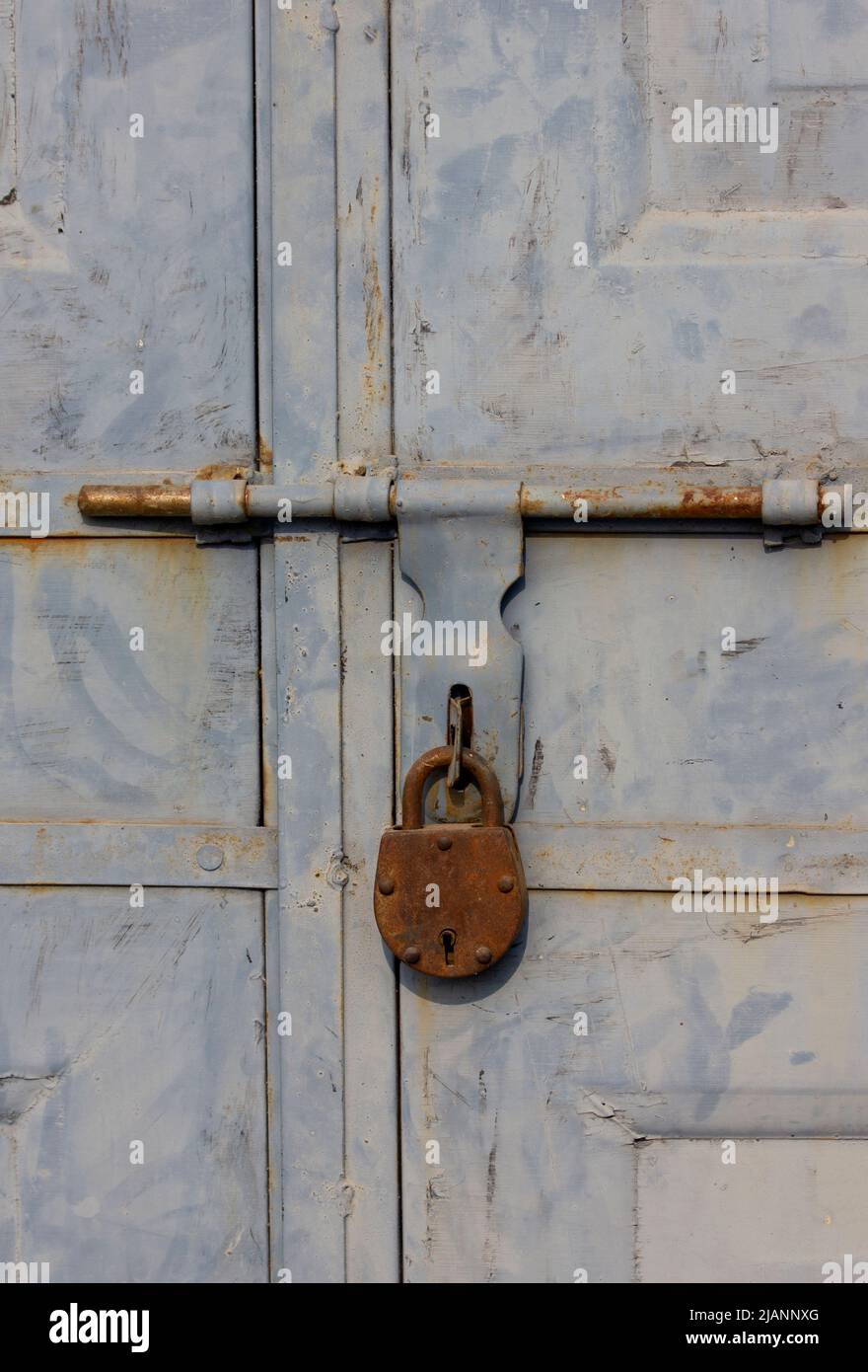 Rusty lock on a metal door Stock Photo - Alamy