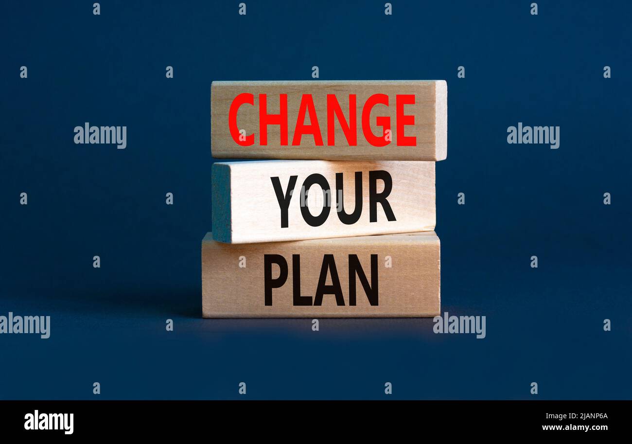 Change your plan symbol. Concept words Change your plan on wooden blocks on a beautiful grey ...