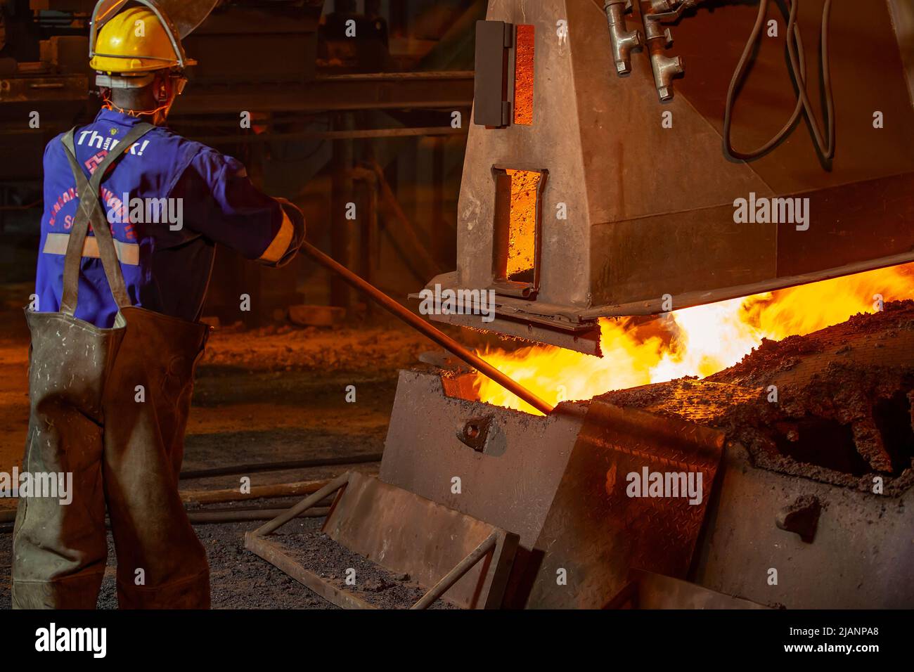 Man with long handle crucible, First Quantum Minerals copper smelter ...