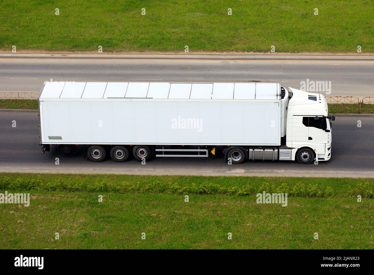 Truck on highway in motion, side view. Commercial cargo van, freight ...