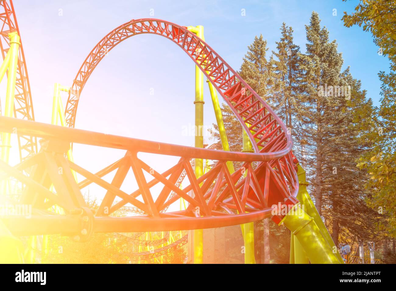 Loop and turn on a red roller coaster in an amusement park Stock Photo ...