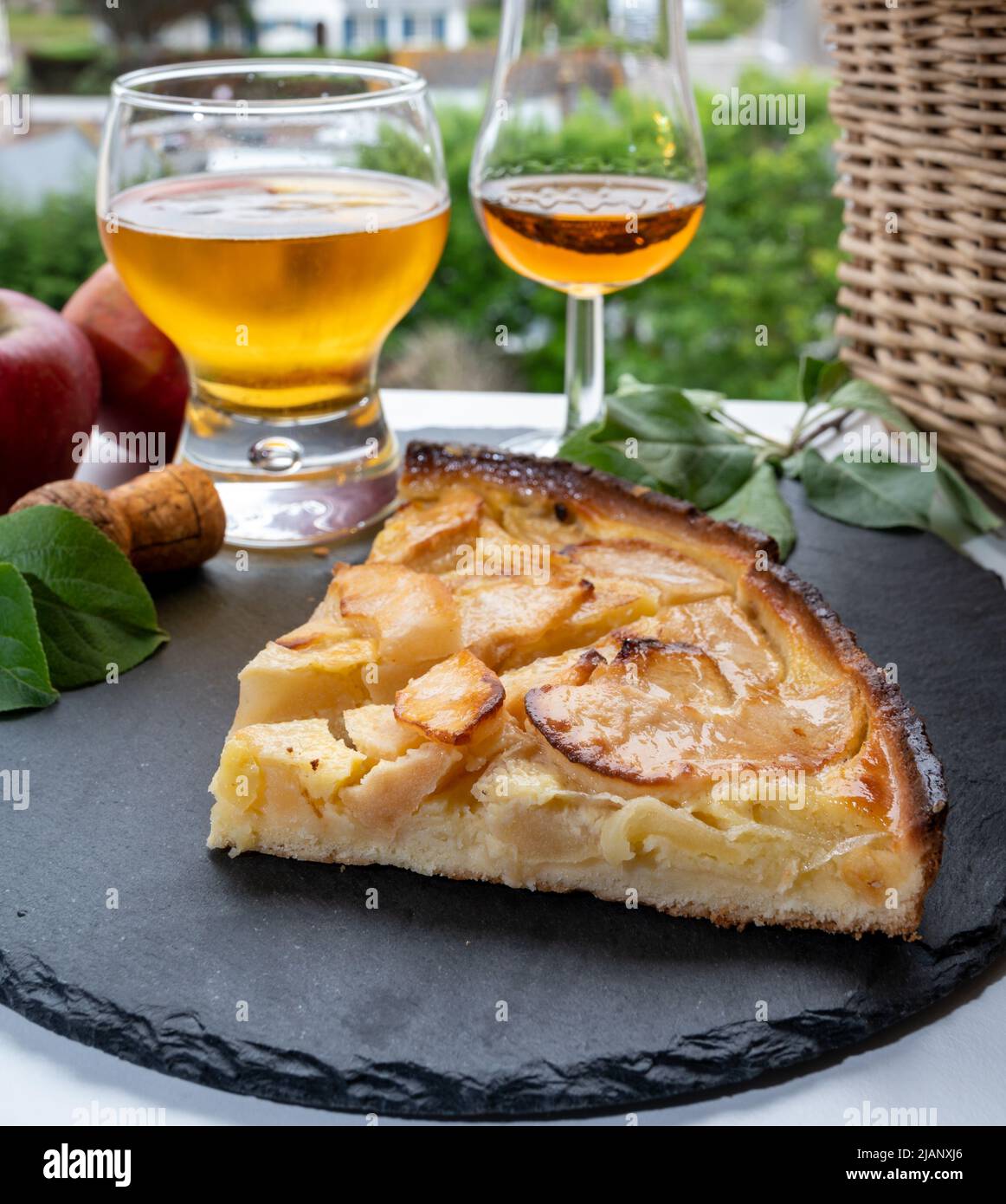 Apple products of Normandy region, homemade baked apple cake, glasses ...
