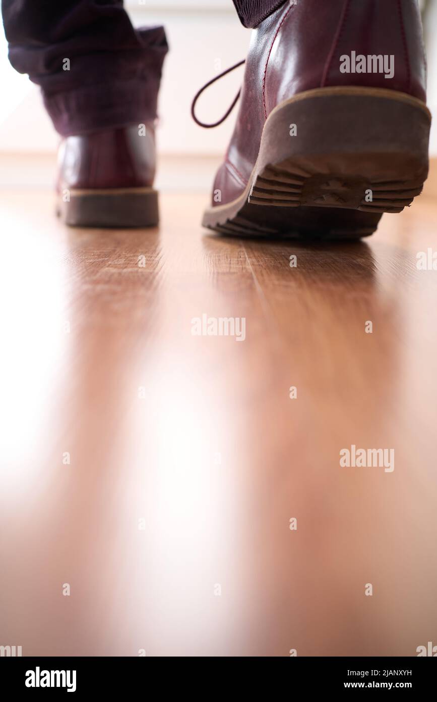 View from behind shoes taking a step away and copyspace Stock Photo - Alamy