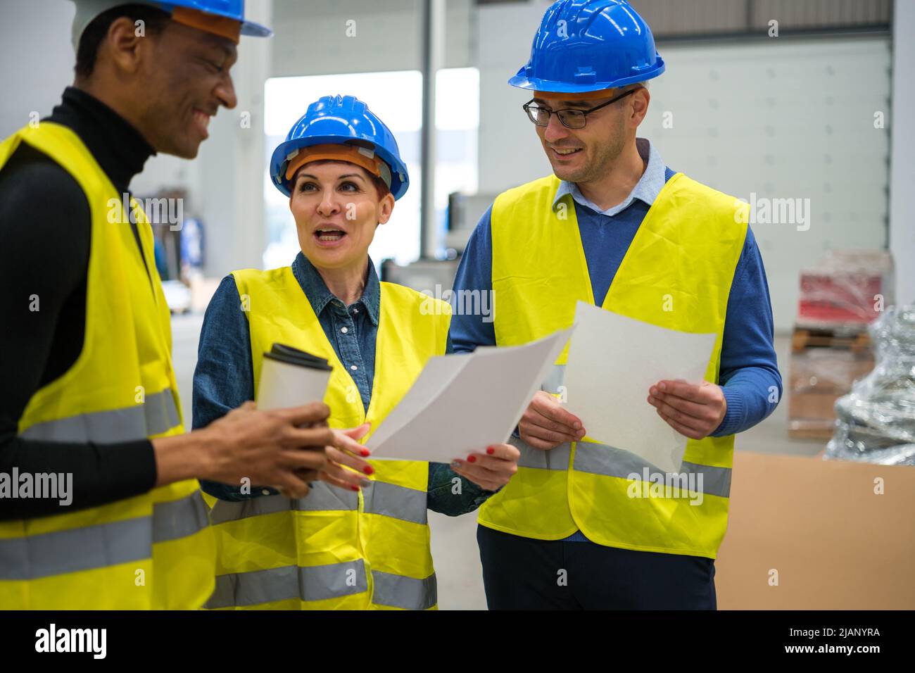 Workers with diverse ethnic characteristics working together Stock ...