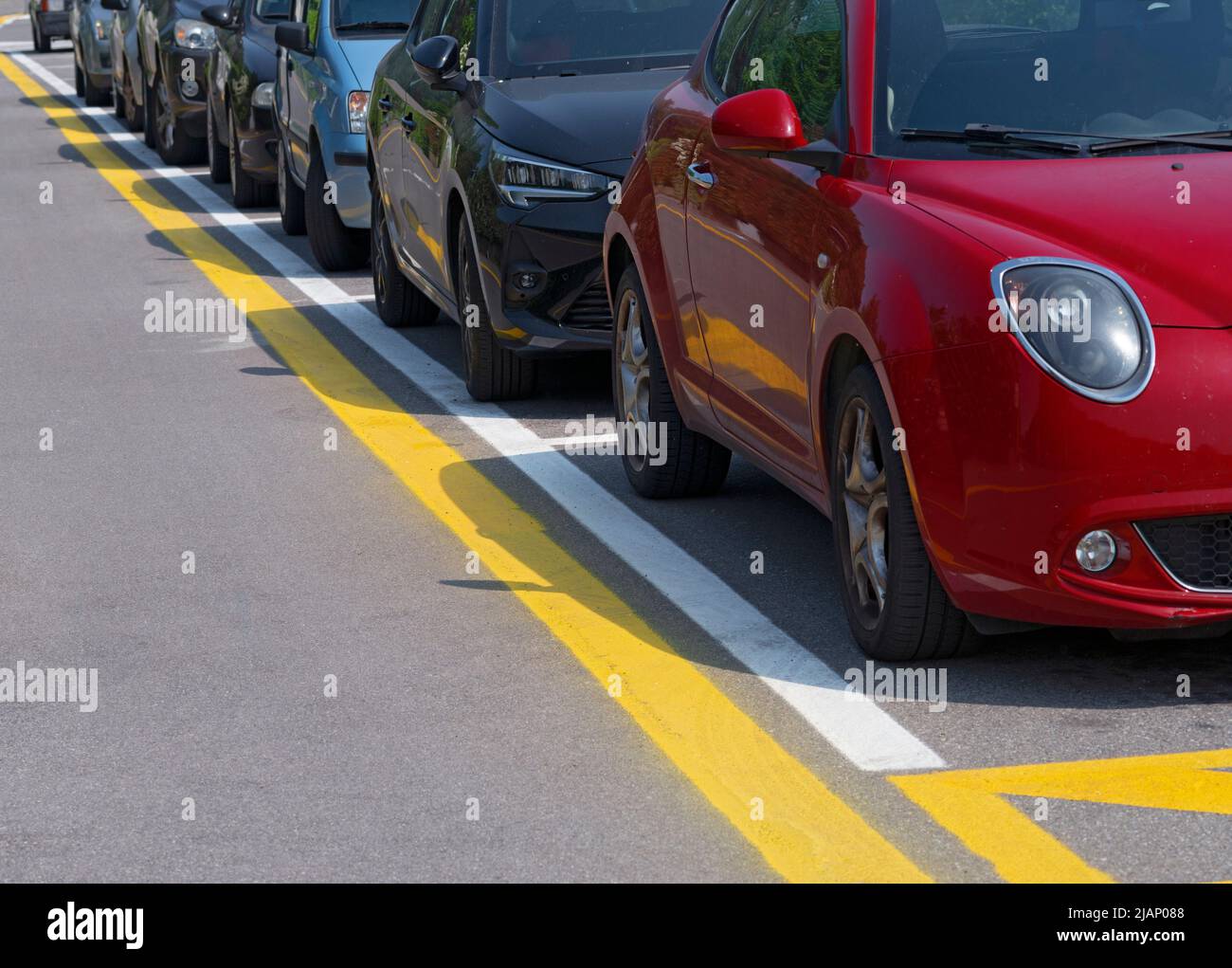 A Line of Parked Cars on a Street Stock Photo - Alamy