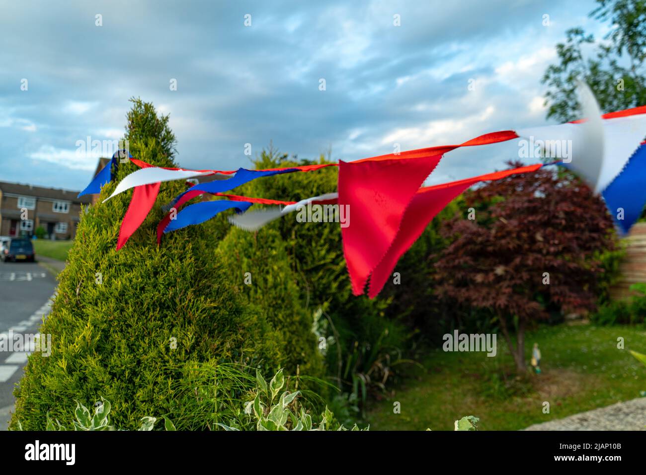 Bunting flags in colors of british flag, white, red and blue each in ...