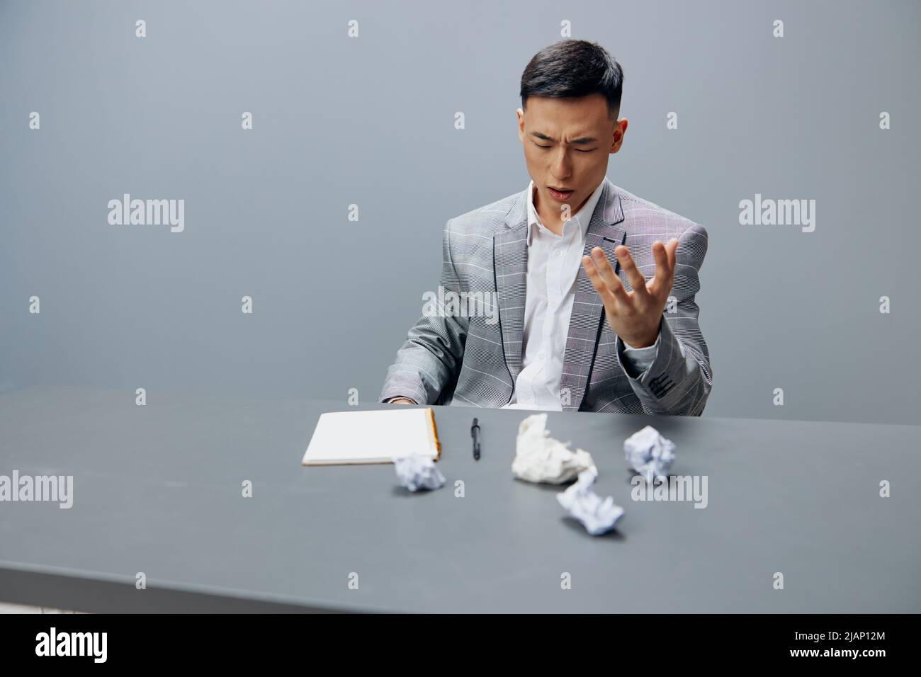 man in a gray suit crumpled paper office official emotions isolated ...