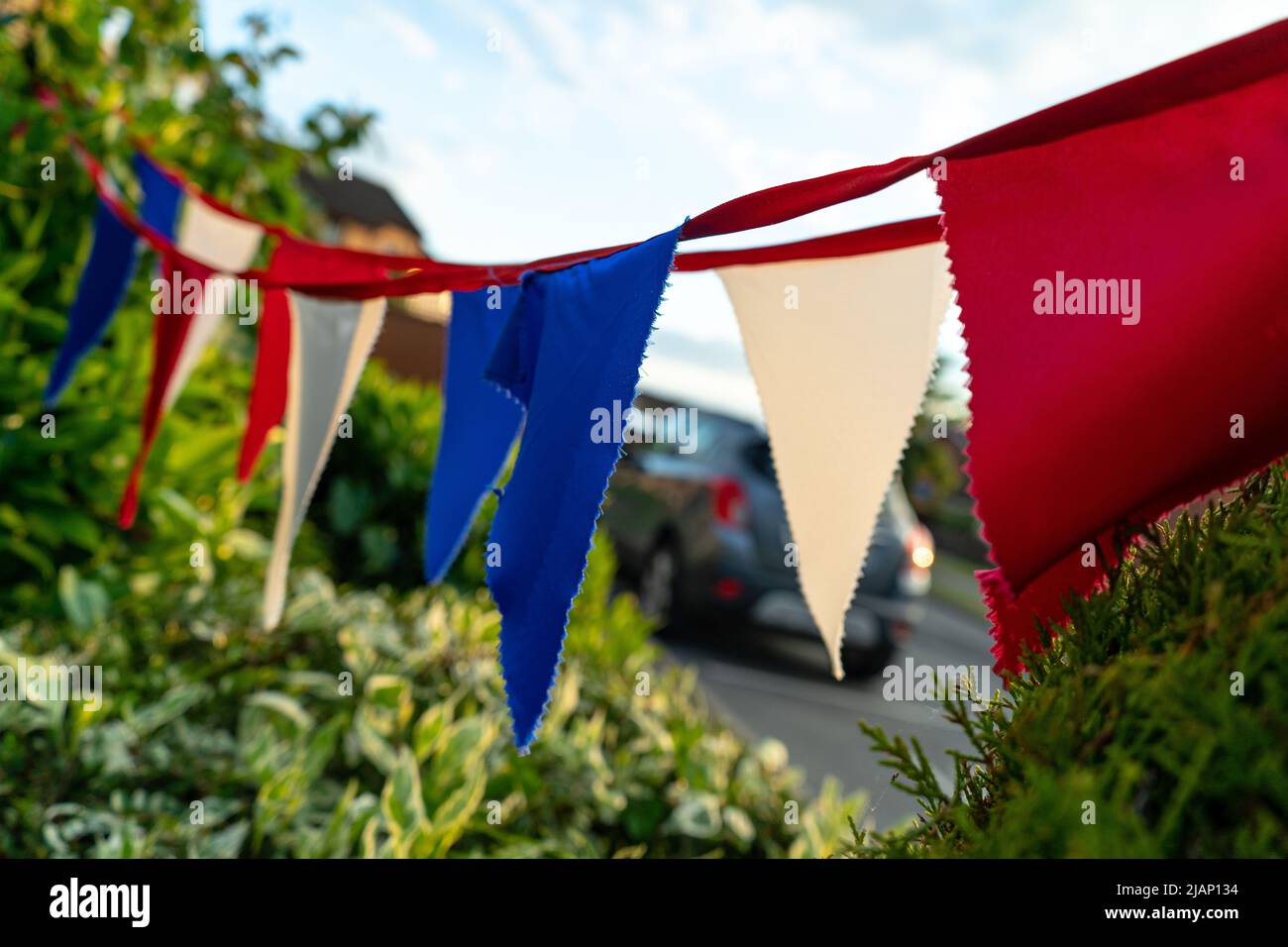 Bunting flags in colors of british flag, white, red and blue each in ...