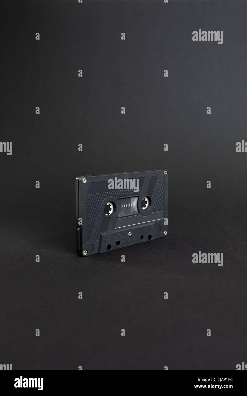 Audio cassette close up, isolated on dark grey background. Analog Audio ...