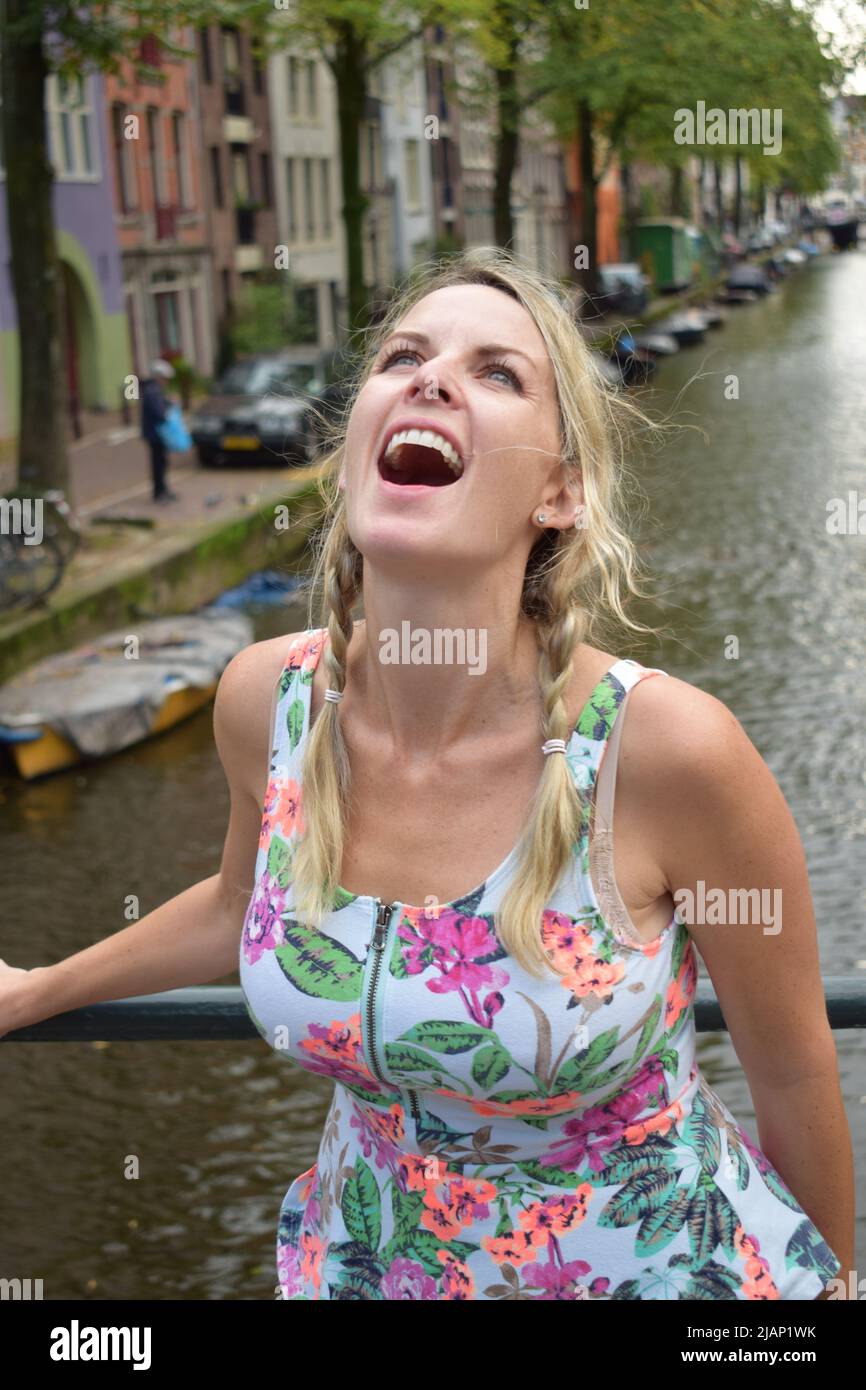 Beautiful Woman on Canal in Amsterdam Posing Stock Photo - Alamy