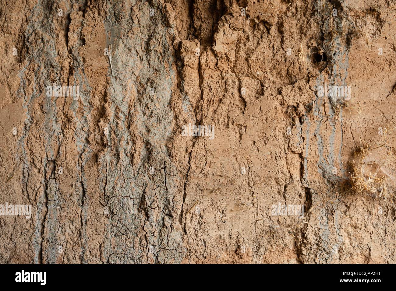 Clay aged dry texture from the interior wall of a dugout dirt garage ...