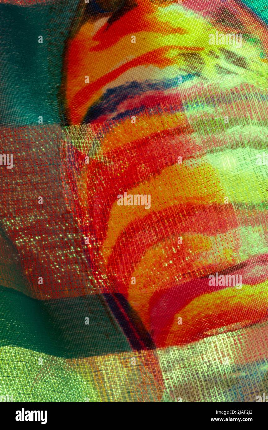 Backlit fabric thru glass shows mysterious head figure that looks ...