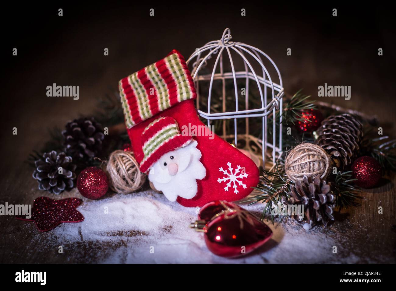 Christmas candle and festive accessories on the table Stock Photo - Alamy
