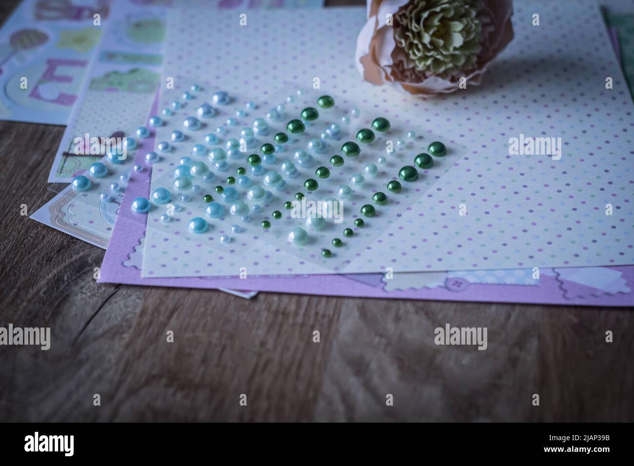 set of shiny beads on a creative background Stock Photo - Alamy