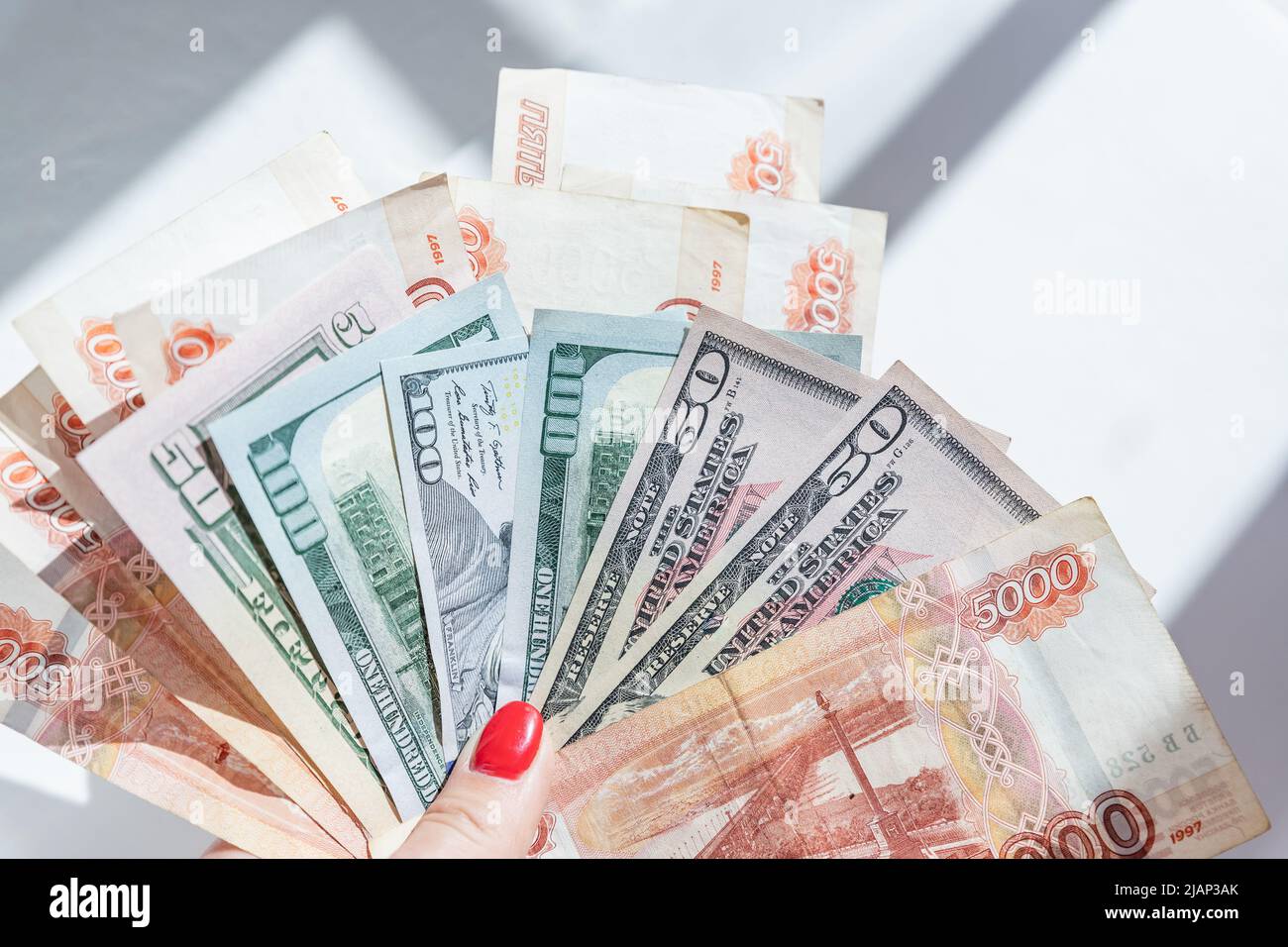 One hundred rubles lying on american dollars as a symbol of weakness ...