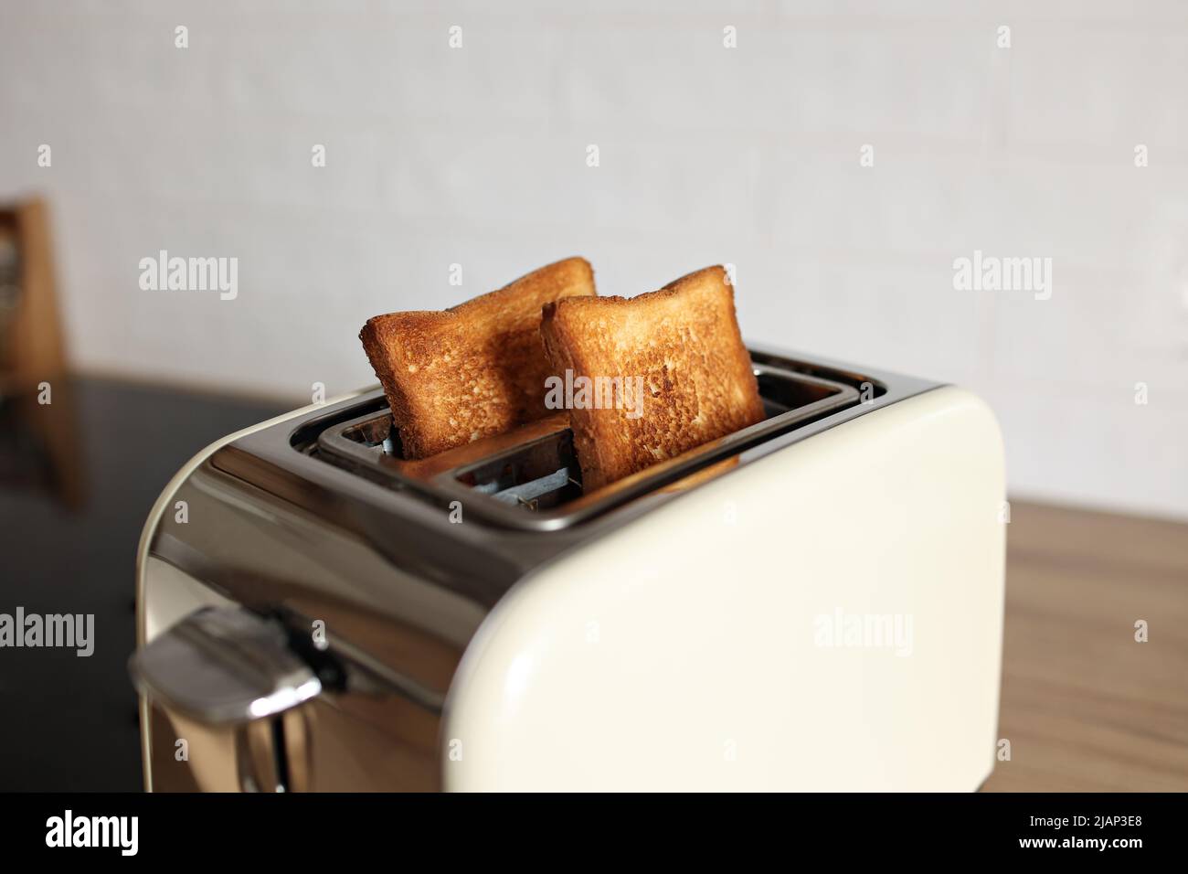 toasted grain bread in white toaster, roasted sandwich toast, concept ...