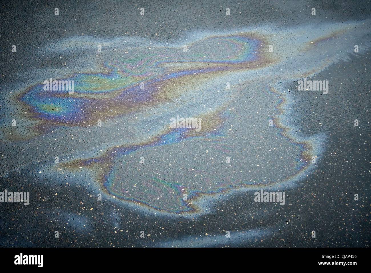 Gasoline oil spill on the pavement as a texture or background Stock ...