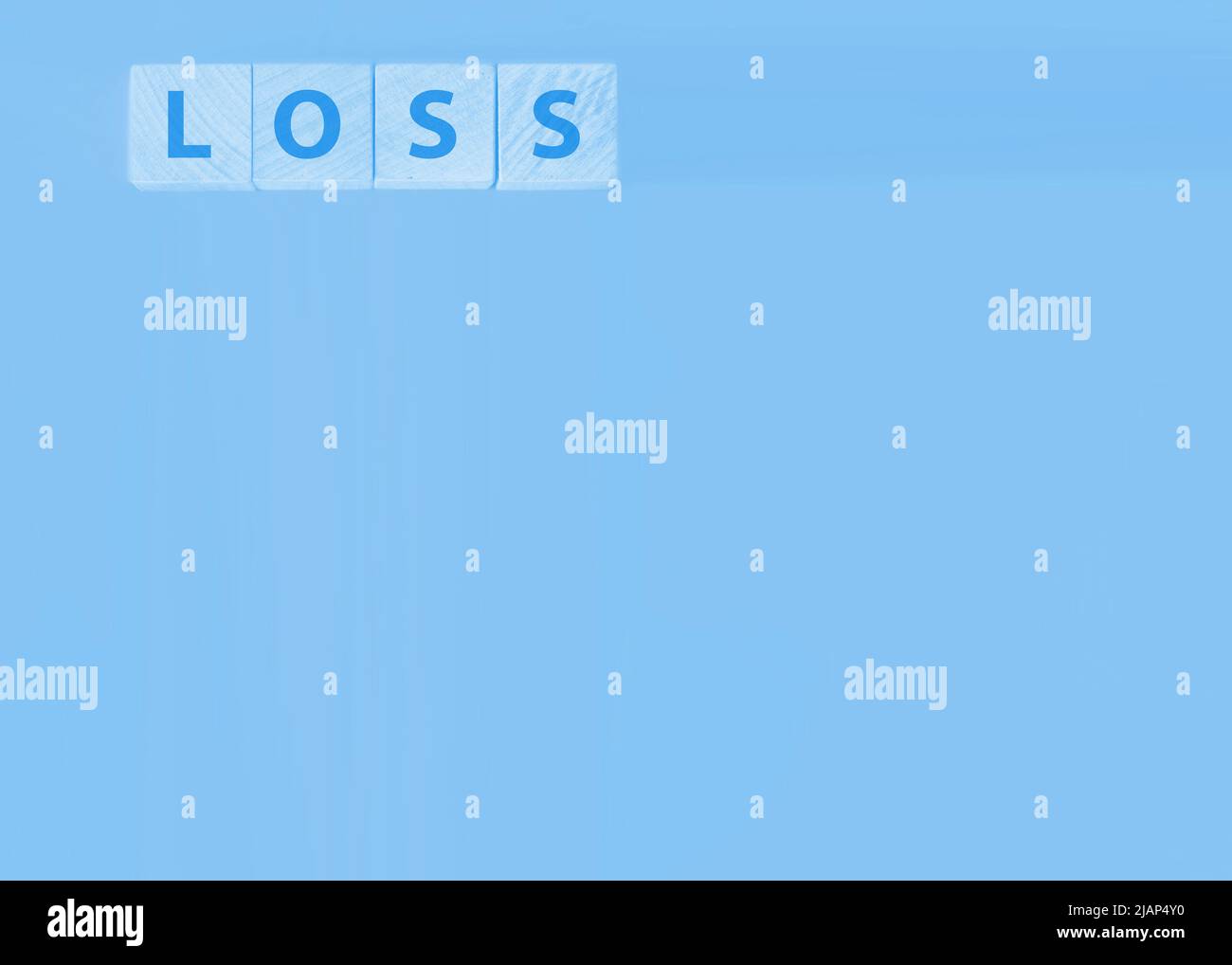 Wooden cubes with LOSS word on sky blue background. Financial loss ...