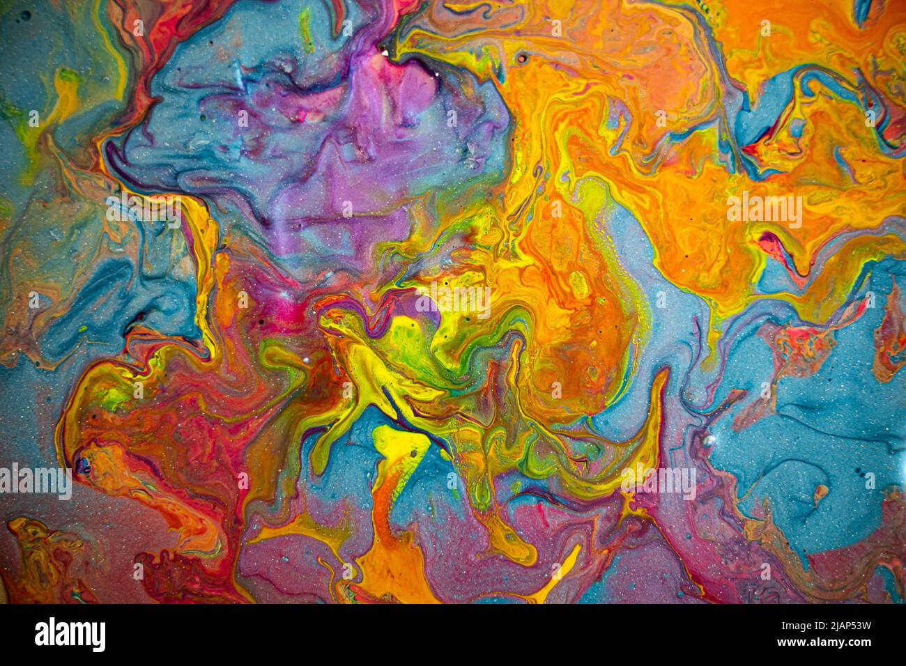 Texture created with paint of vibrant and diverse colors that create an ...