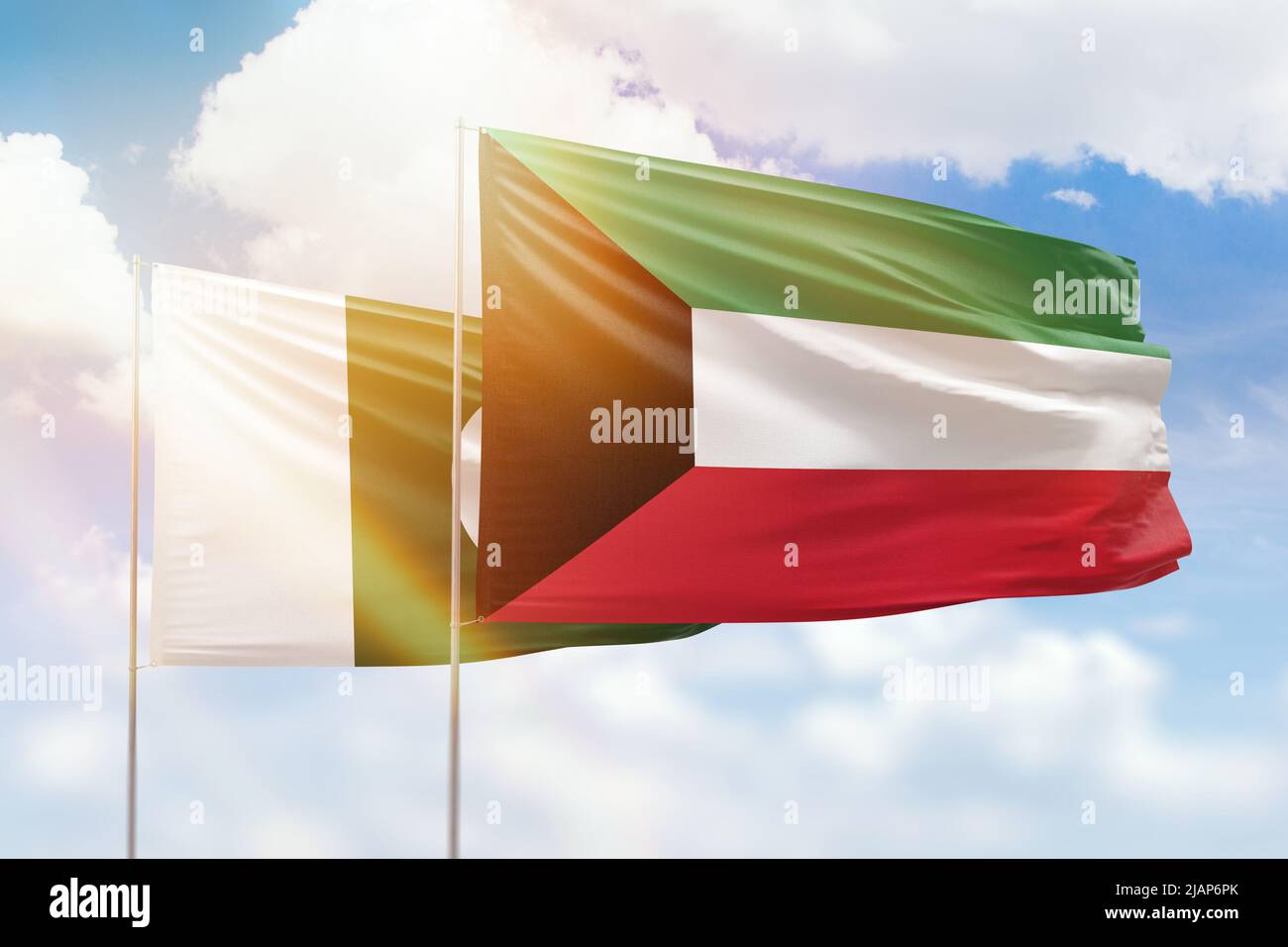 Sunny blue sky and flags of kuwait and pakistan Stock Photo - Alamy
