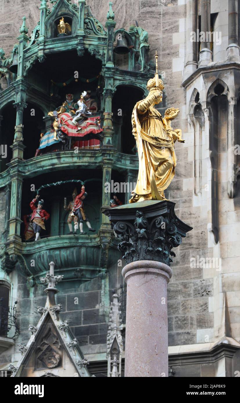 golden Statue of Holy Mary in the Main square of Munich in Germany ...