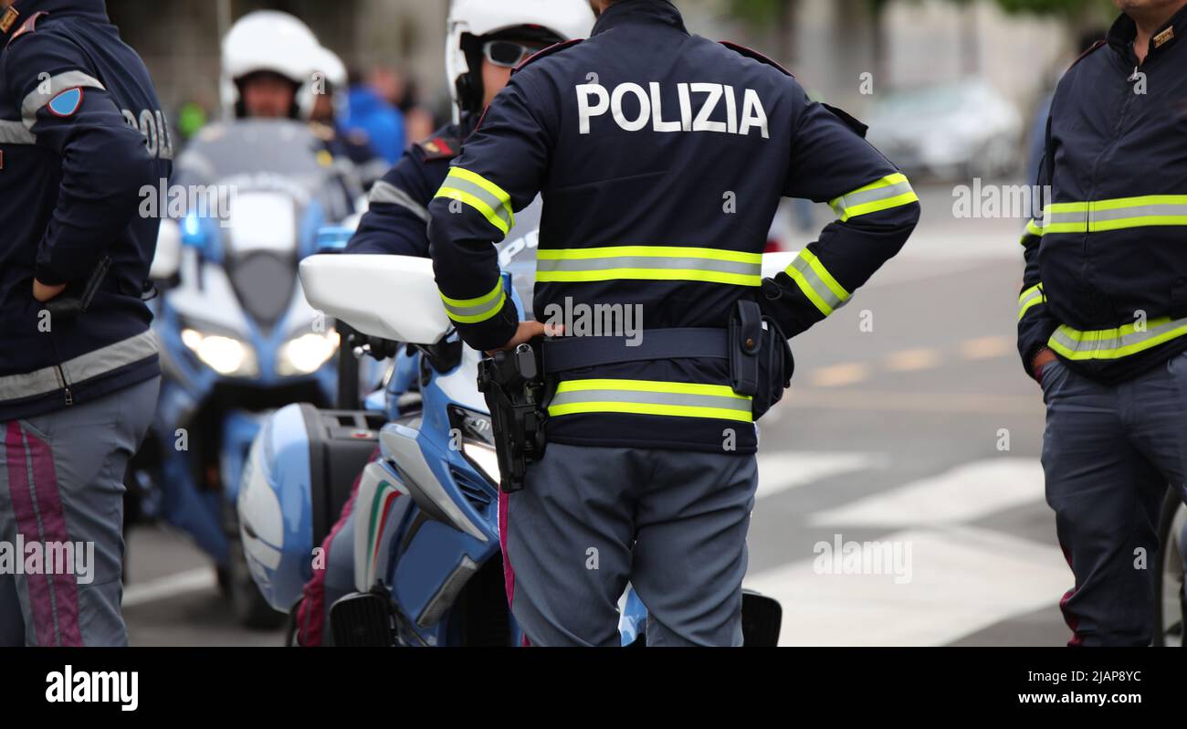 CheckPoint with many policemen and uniform with text POLIZIA that means ...