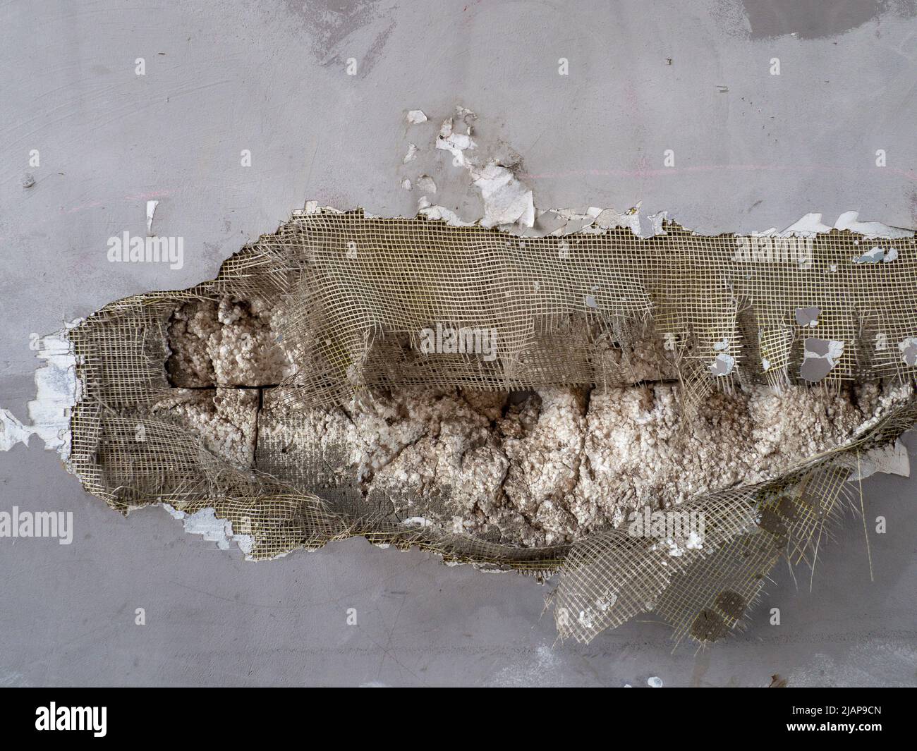 Broken wall, insulation. Renovation work. Repair Stock Photo - Alamy