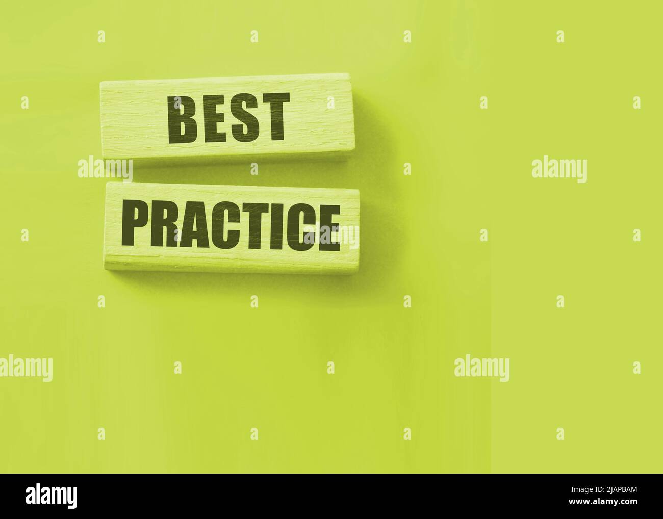 Best practice words in wooden blocks on red. Business or healthcare ...