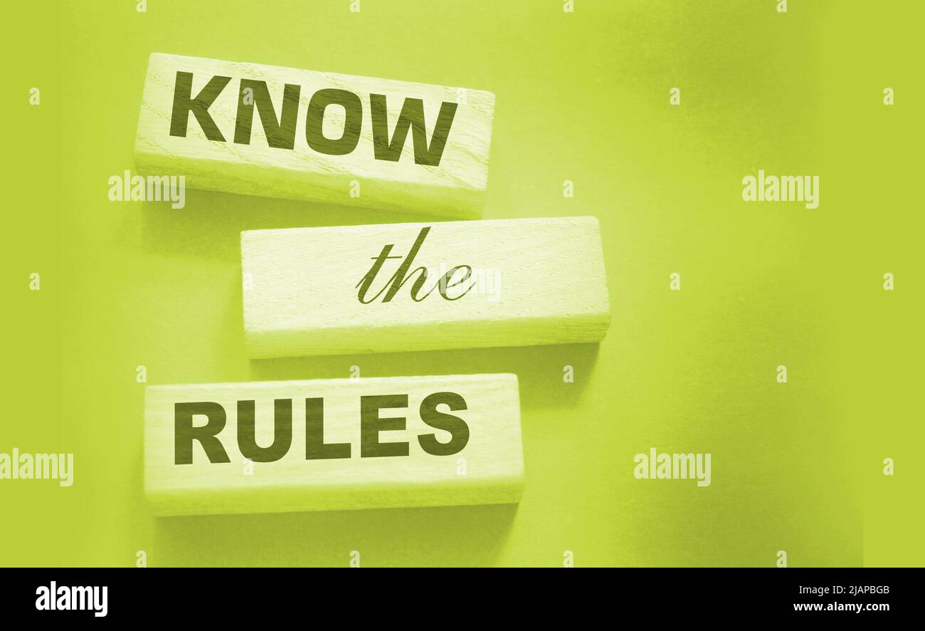 Know the rules word on wooden blocks isolated on dark grey background ...