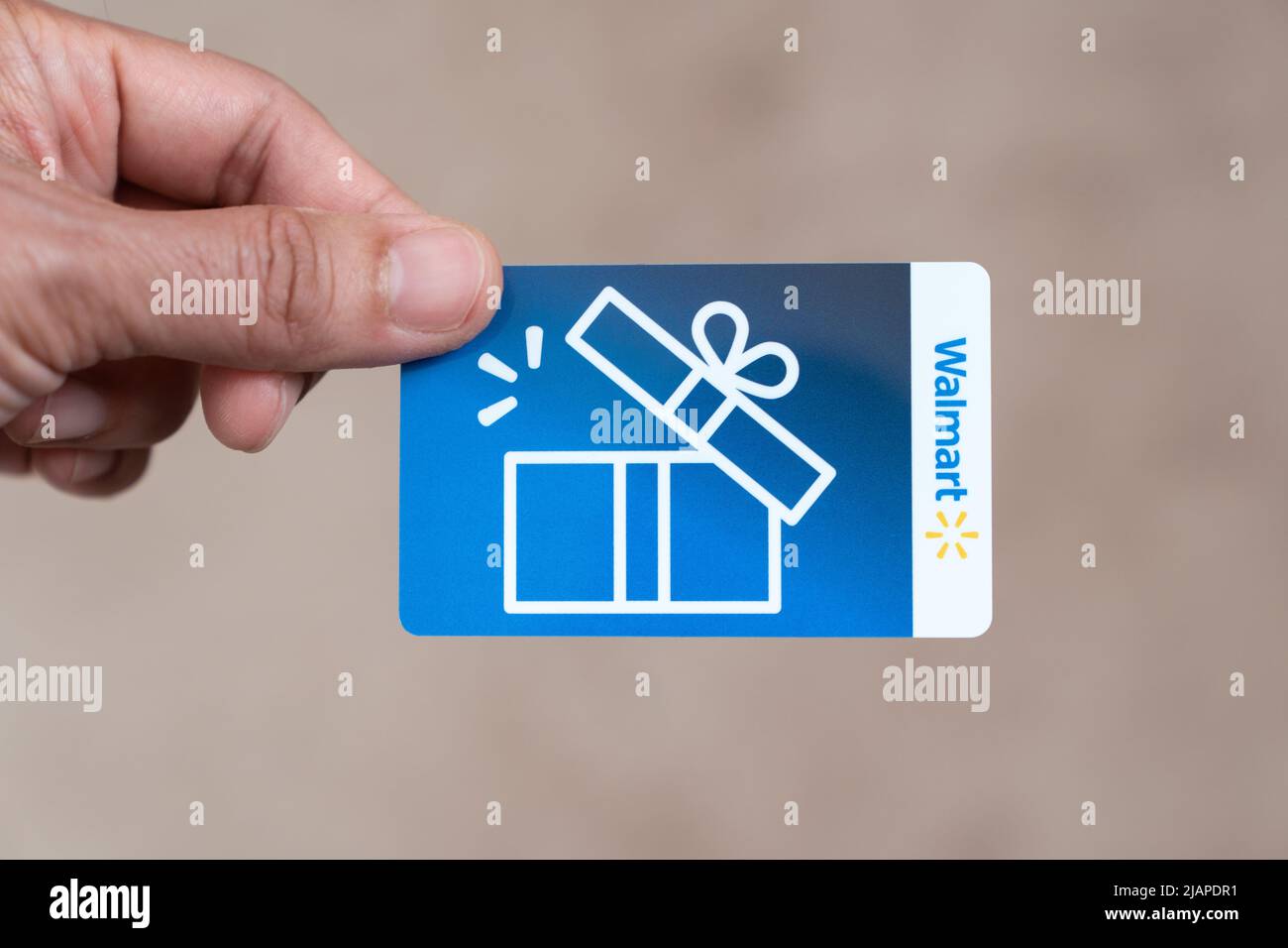 Hand hold a Walmart gift card isolated Stock Photo - Alamy