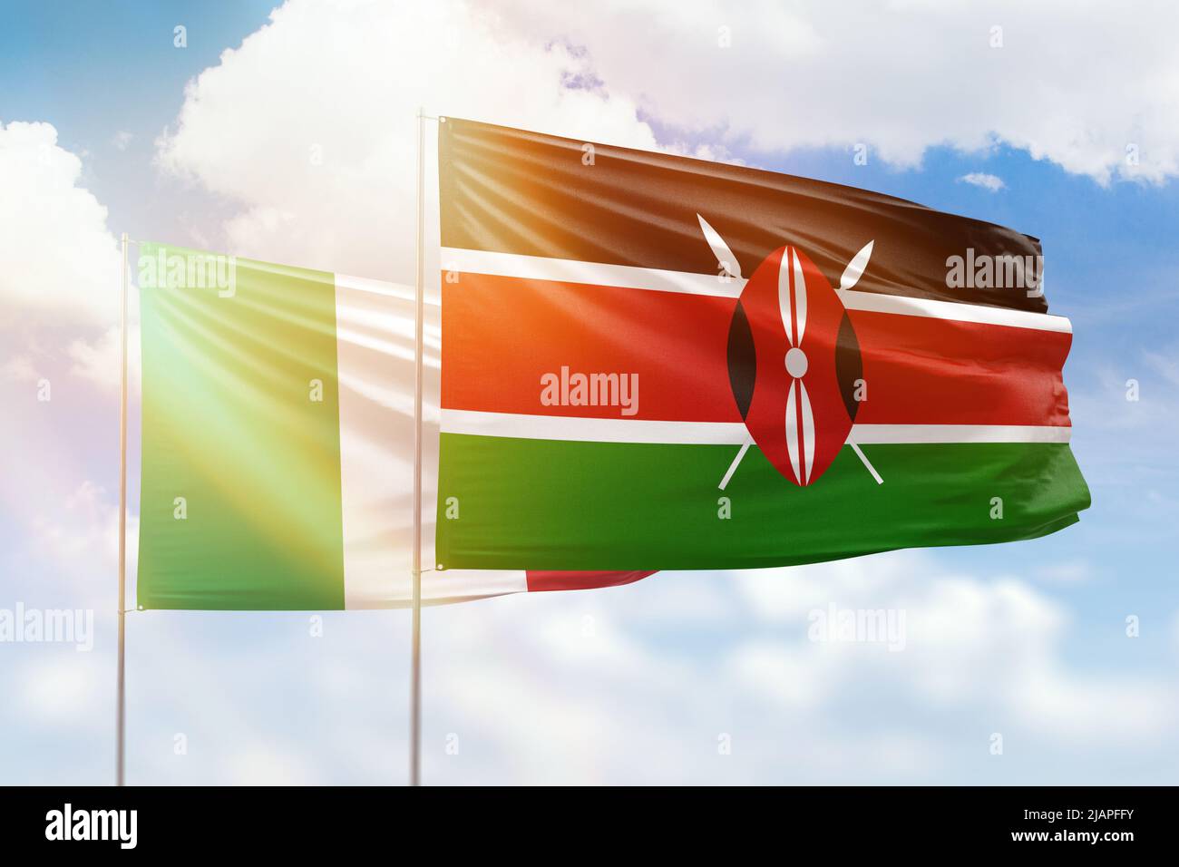 Sunny blue sky and flags of kenya and italy Stock Photo - Alamy