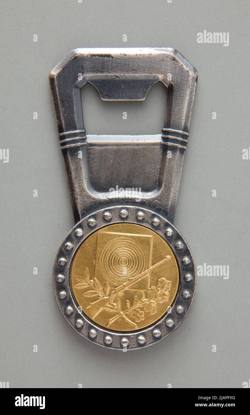 Caps opener with a commemorative shooting medal of competition for the ...