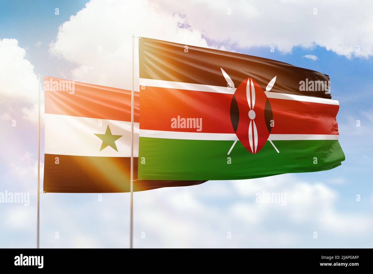 Sunny blue sky and flags of kenya and syria Stock Photo - Alamy