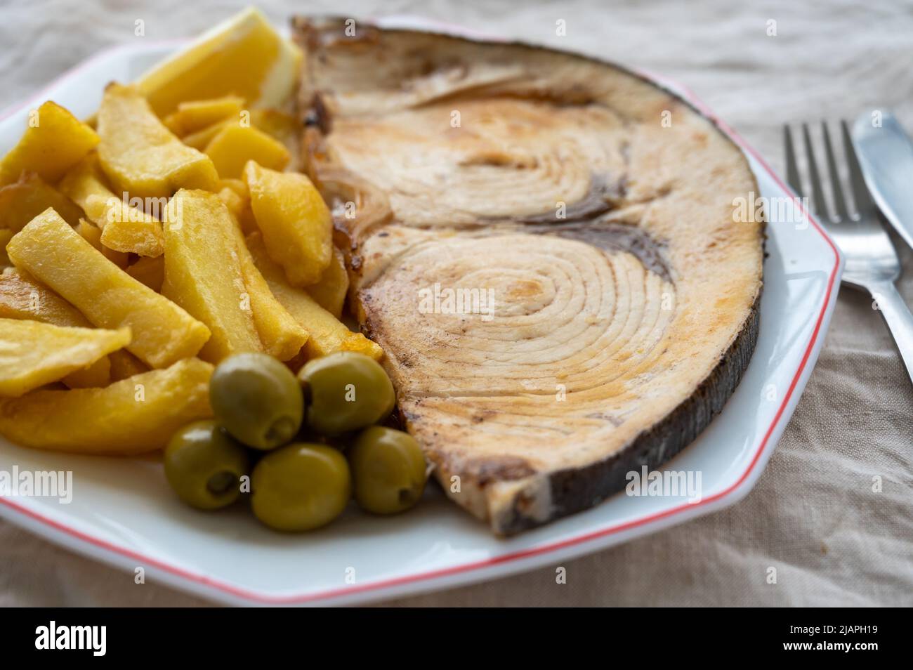 Seafood dish, grilled steak from swordfish or spada served with french ...