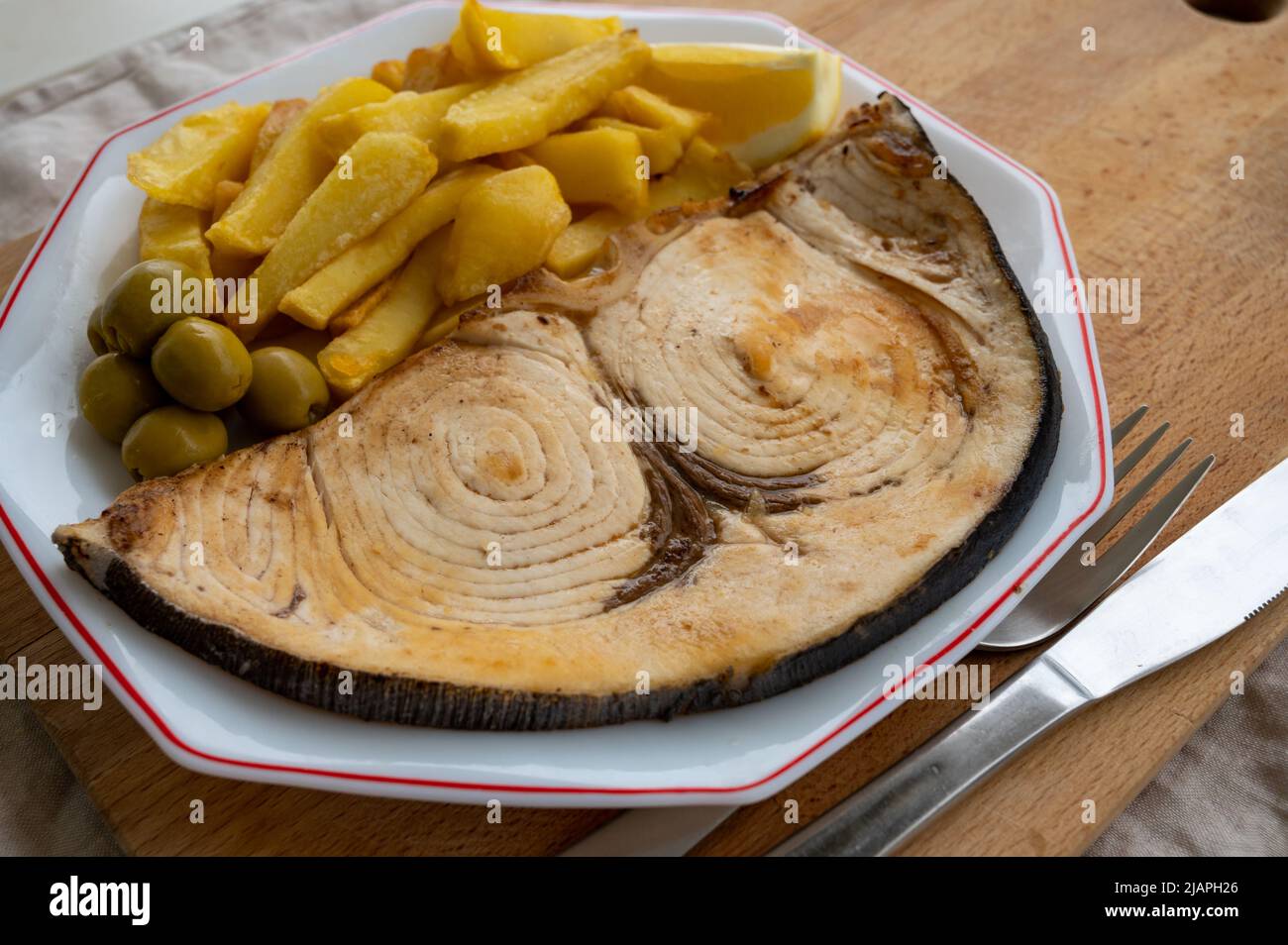 Seafood dish, grilled steak from swordfish or spada served with french ...