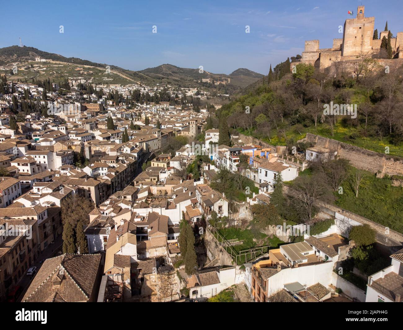Aerial panoramic view on buildings, old district, mountains and ...