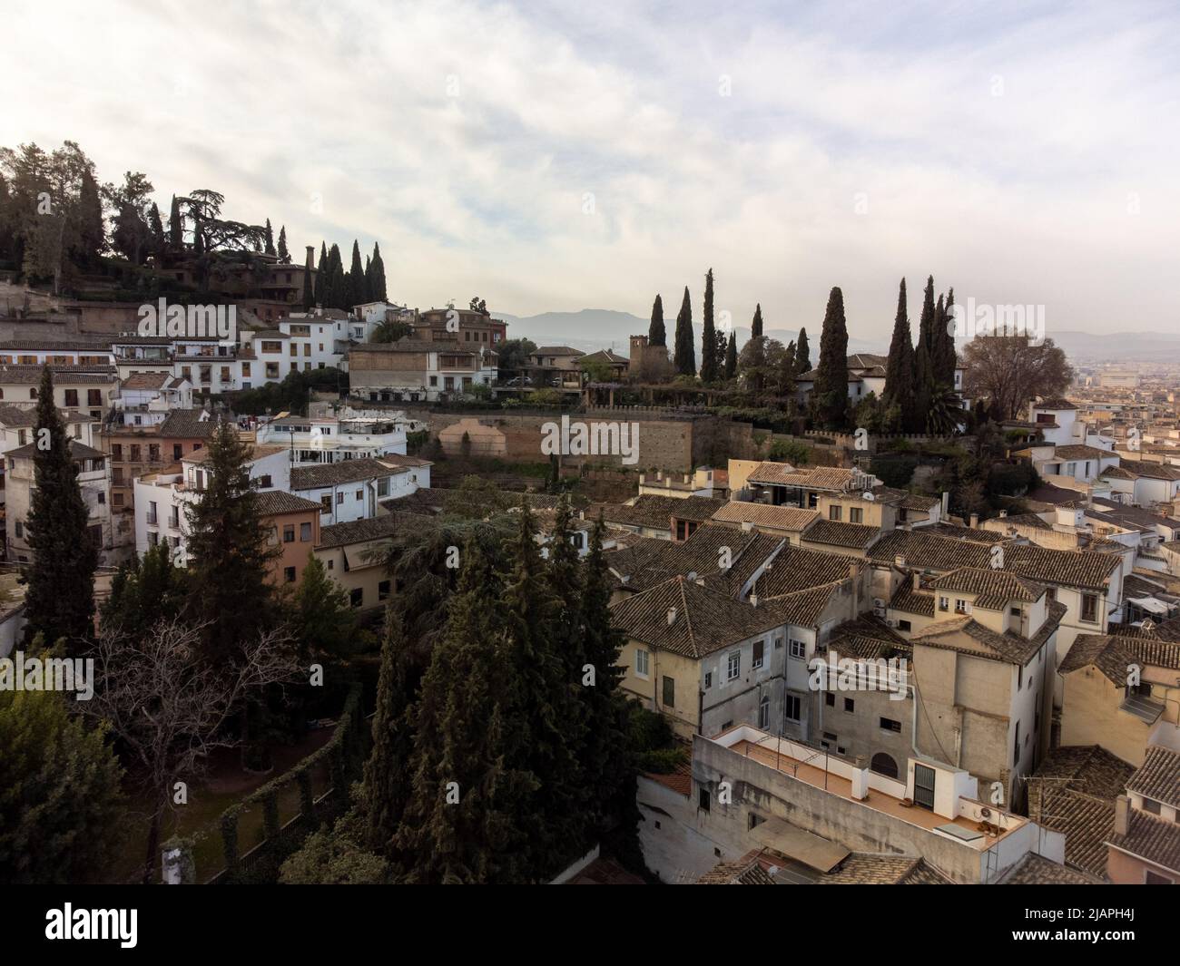 Aerial panoramic view on buildings, old district, mountains and palace ...