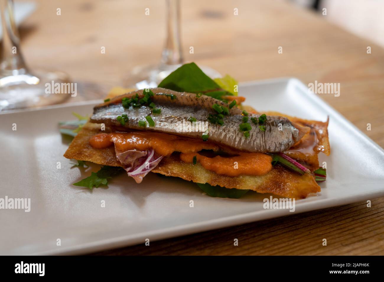 Spanish food, one tapas small piece of roasted bread cracker with ...