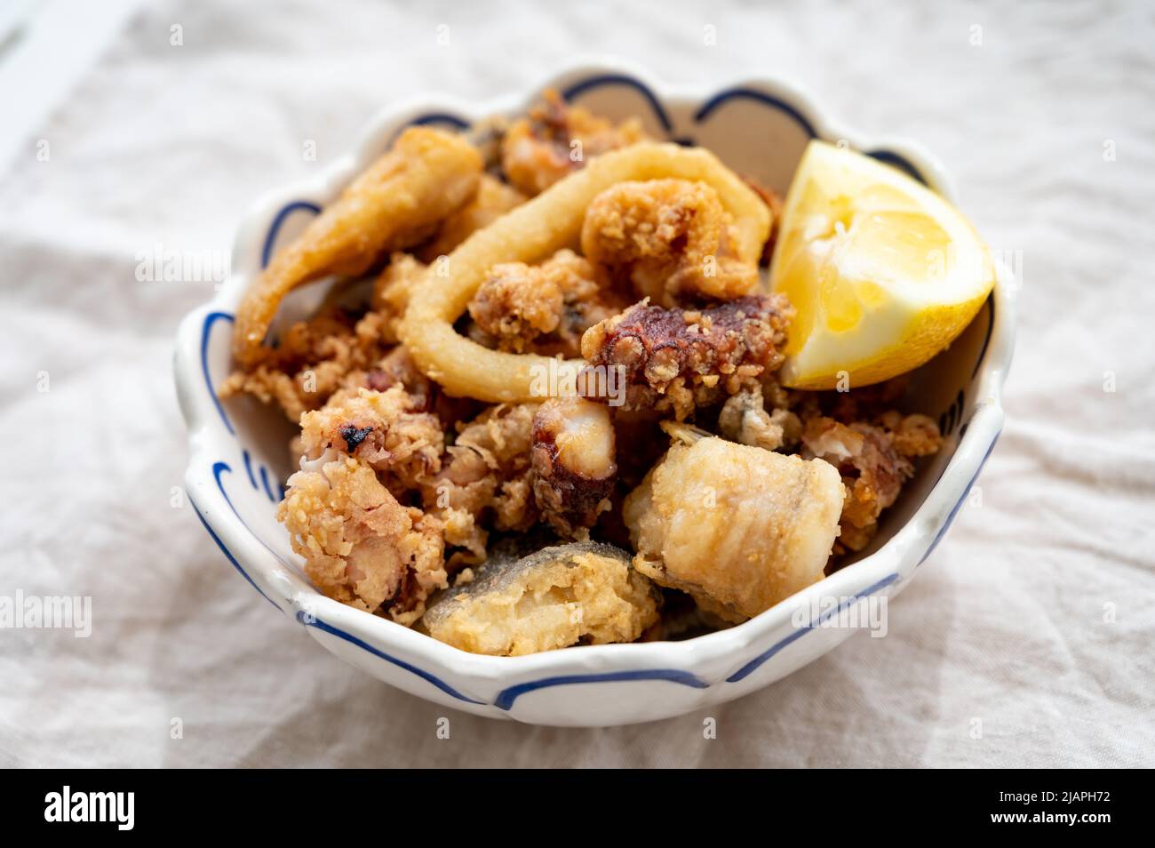 Spanish sea food, cripsy deep fried baby octopus, fish, calamari rings ...