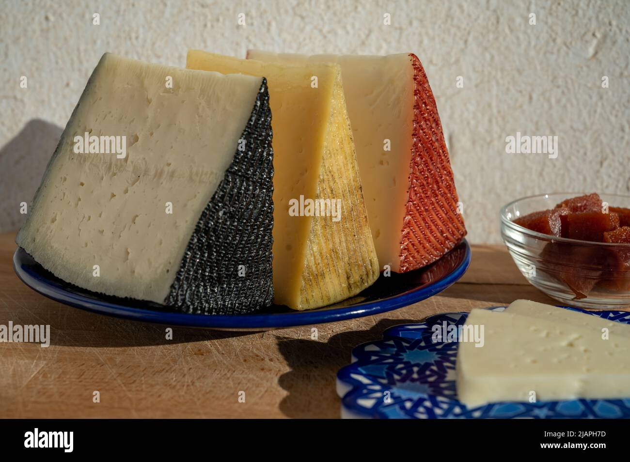 Spanish hard manchego, cow, sheep and goat cheeses served outdoor with ...