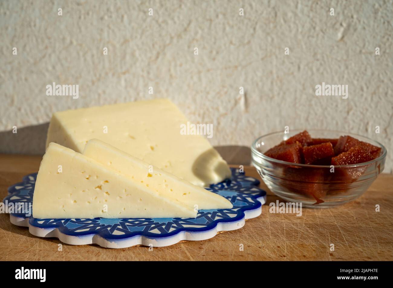 Spanish hard goat cheese served outdoor with membrillo jam in morning ...