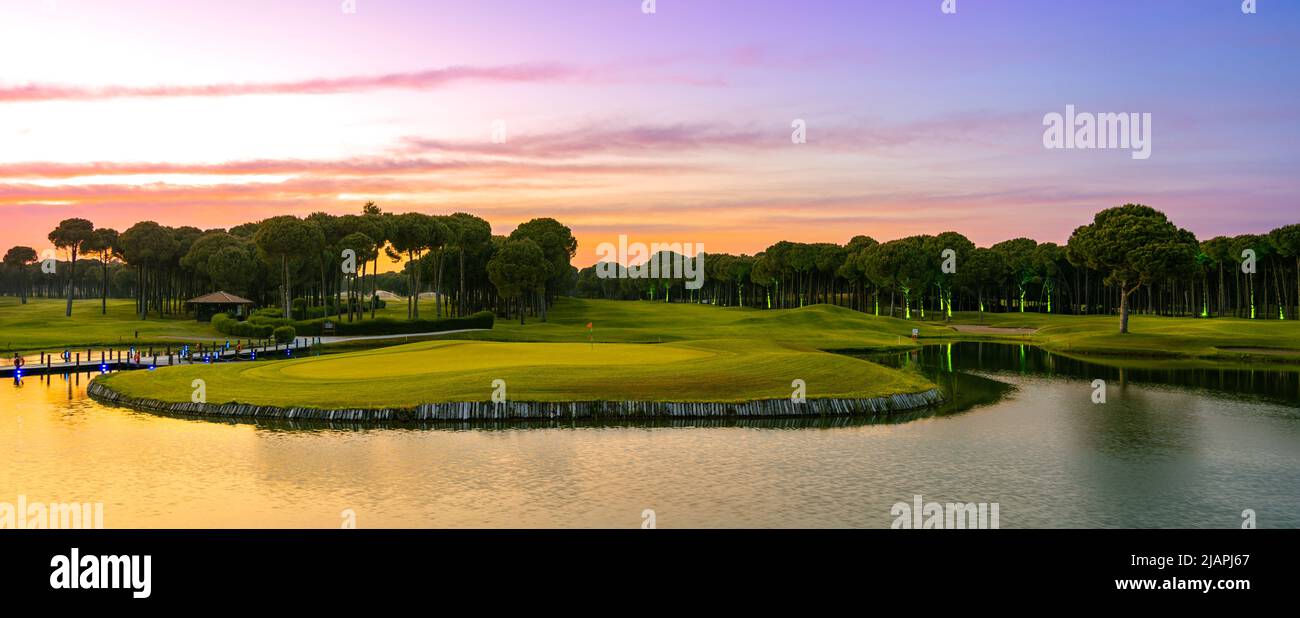 Sunset at the golf course. Scenic panoramic view of golf fairway Stock ...