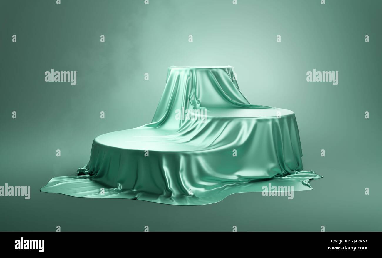 An empty stage studio with silk draped over objects ready for product ...