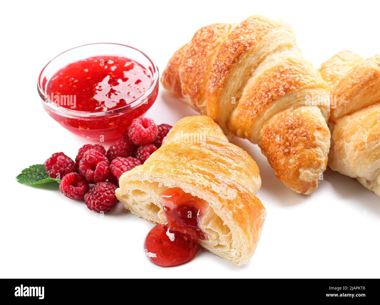Delicious croissants with raspberry jam on white background Stock Photo ...