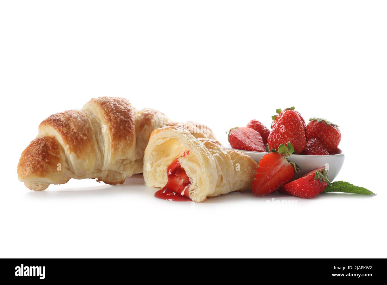 Delicious croissants with strawberry jam on white background Stock ...